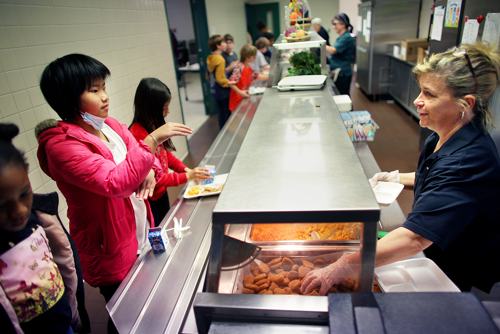 Students learn sign language to communicate with cafeteria worker