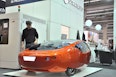 A plastic car with three wheels could zip into the future